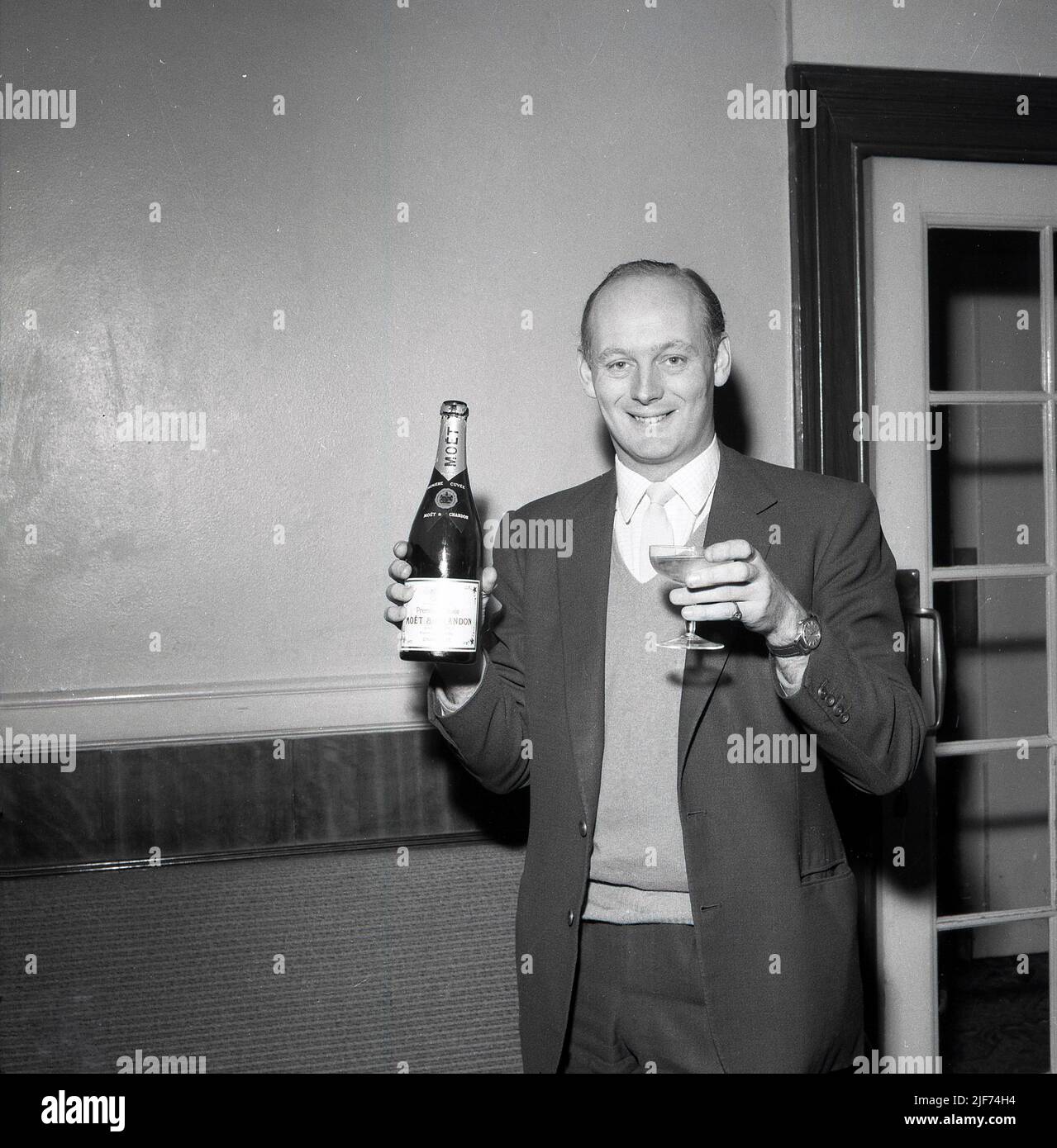 1961, historical, the Lord Montagu of Beaulieu with a bottle and glass ...