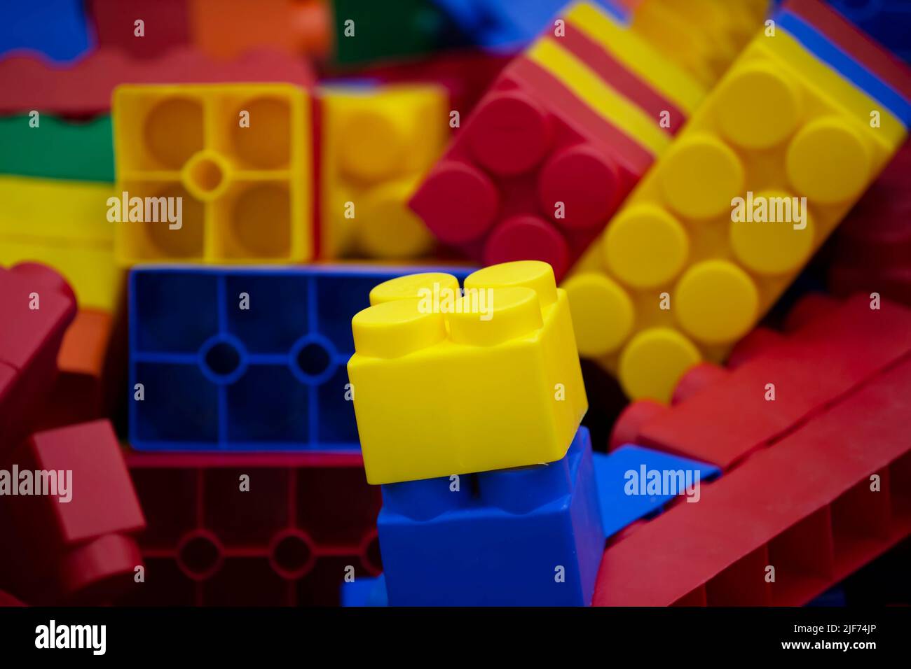 Multi-colored blocks of plastic constructor Stock Photo - Alamy