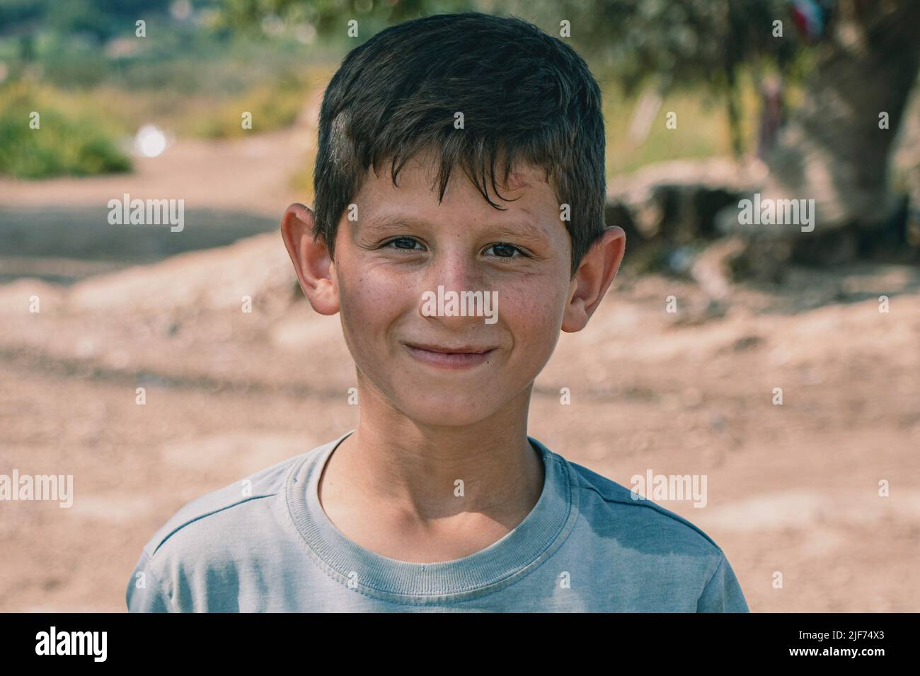Small Syrian boy plays in the garden. Syrian children are seen outside ...
