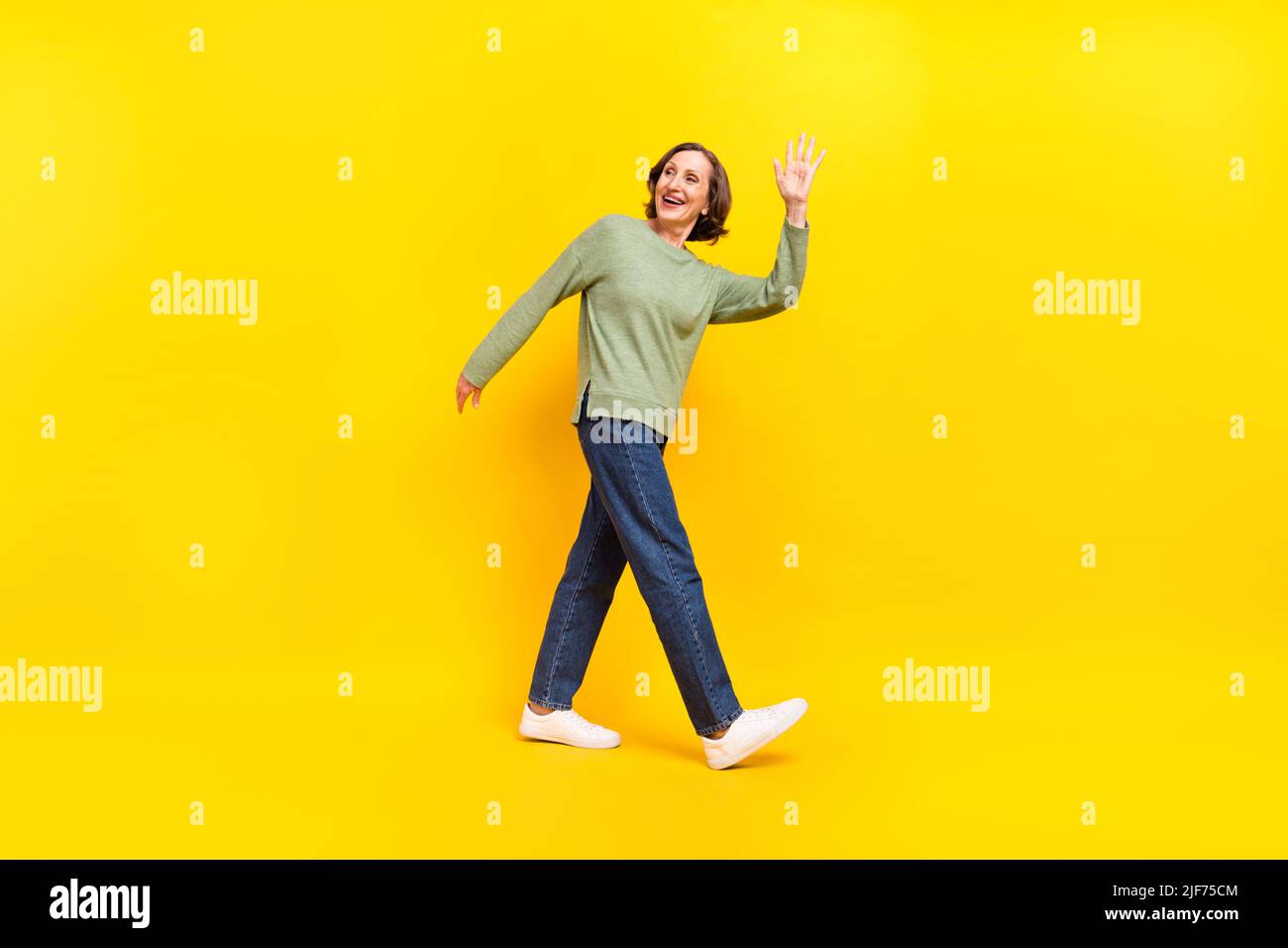 Full length body size view of attractive cheerful middle-aged woman ...