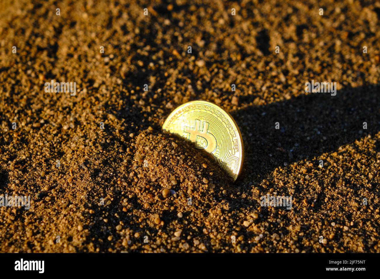 Bitcoin coin in sand at sunset, collapse and fall cryptocurrency Stock ...