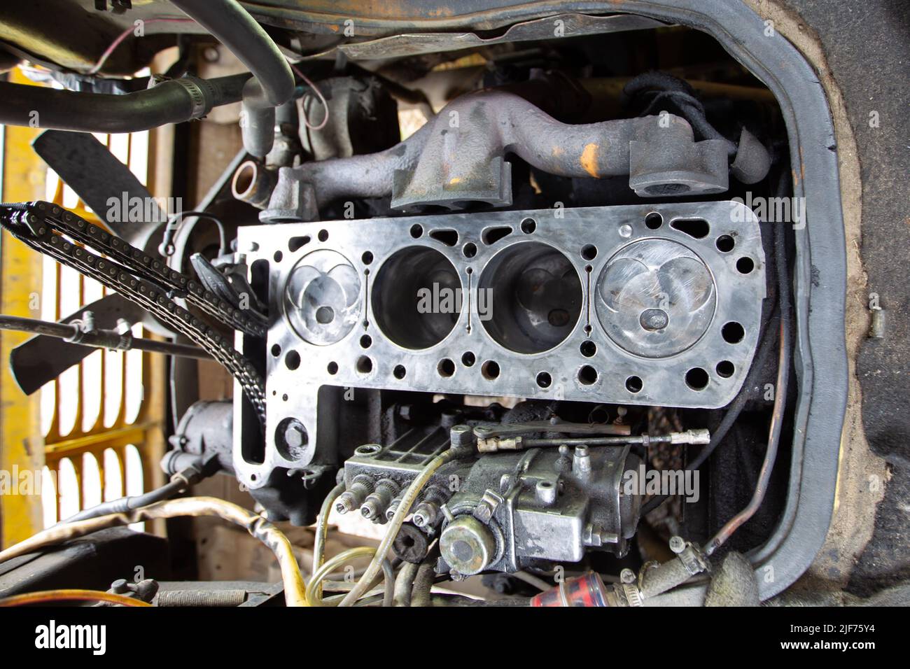 Mercedes diesel engine repair. Hands with a mechanic repairing Mercedes ...