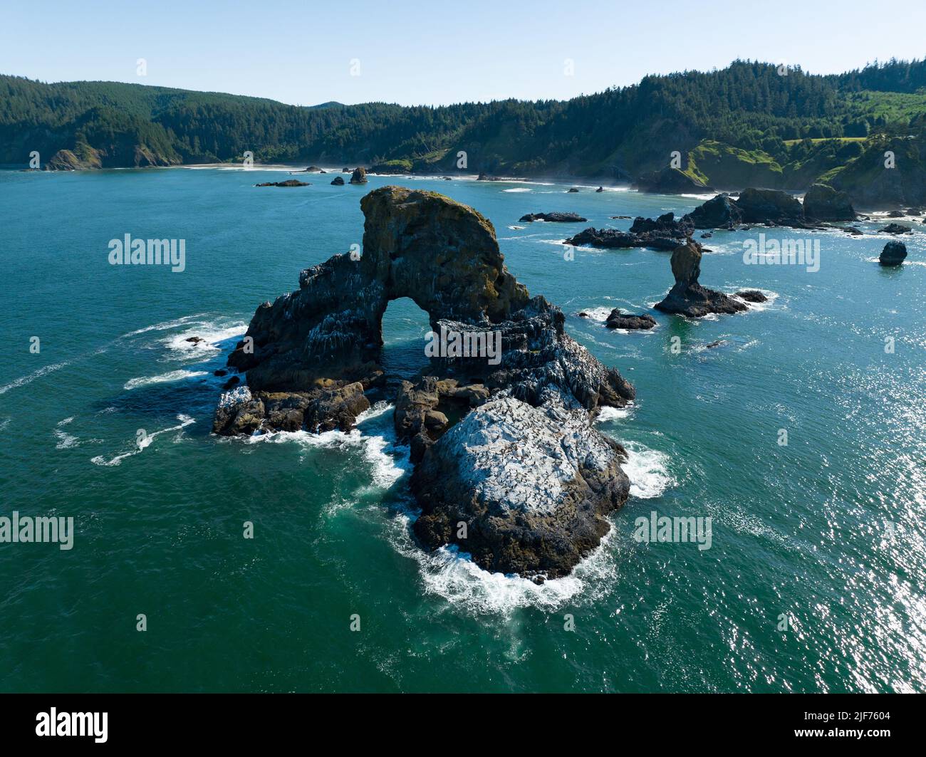 Basalt sea stacks lie just off the Northern Oregon shoreline, not far ...