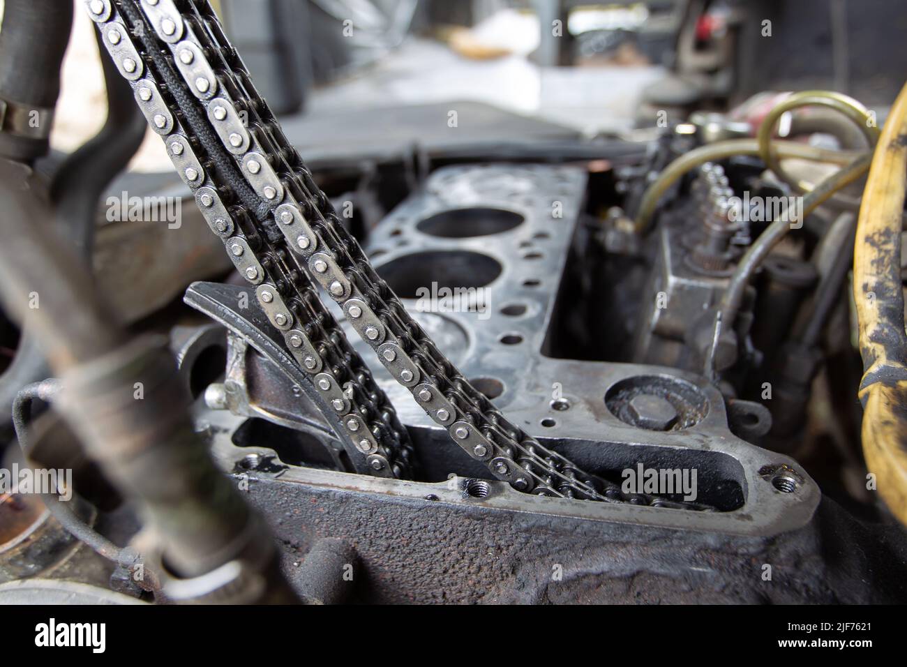 Mercedes diesel engine repair. Hands with a mechanic repairing Mercedes ...