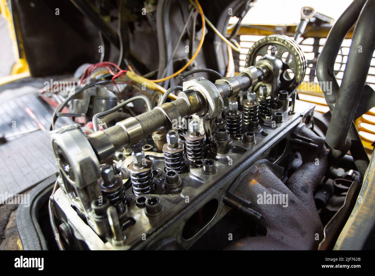 Mercedes diesel engine repair. Hands with a mechanic repairing Mercedes ...