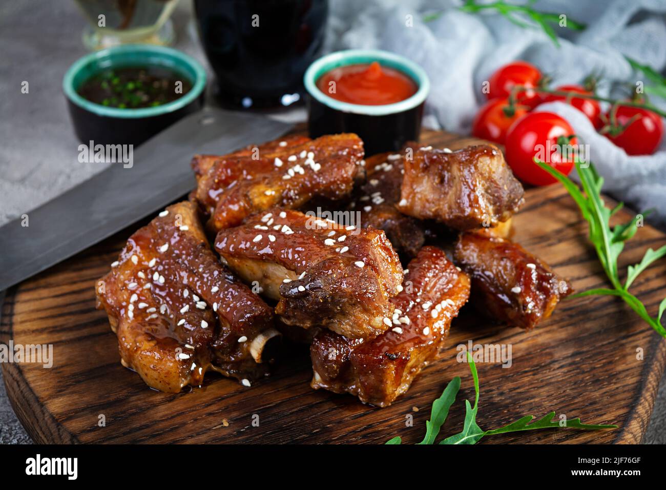 Grilled sliced ribs in sweet and sour sauce. Ribs marinated in honey ...