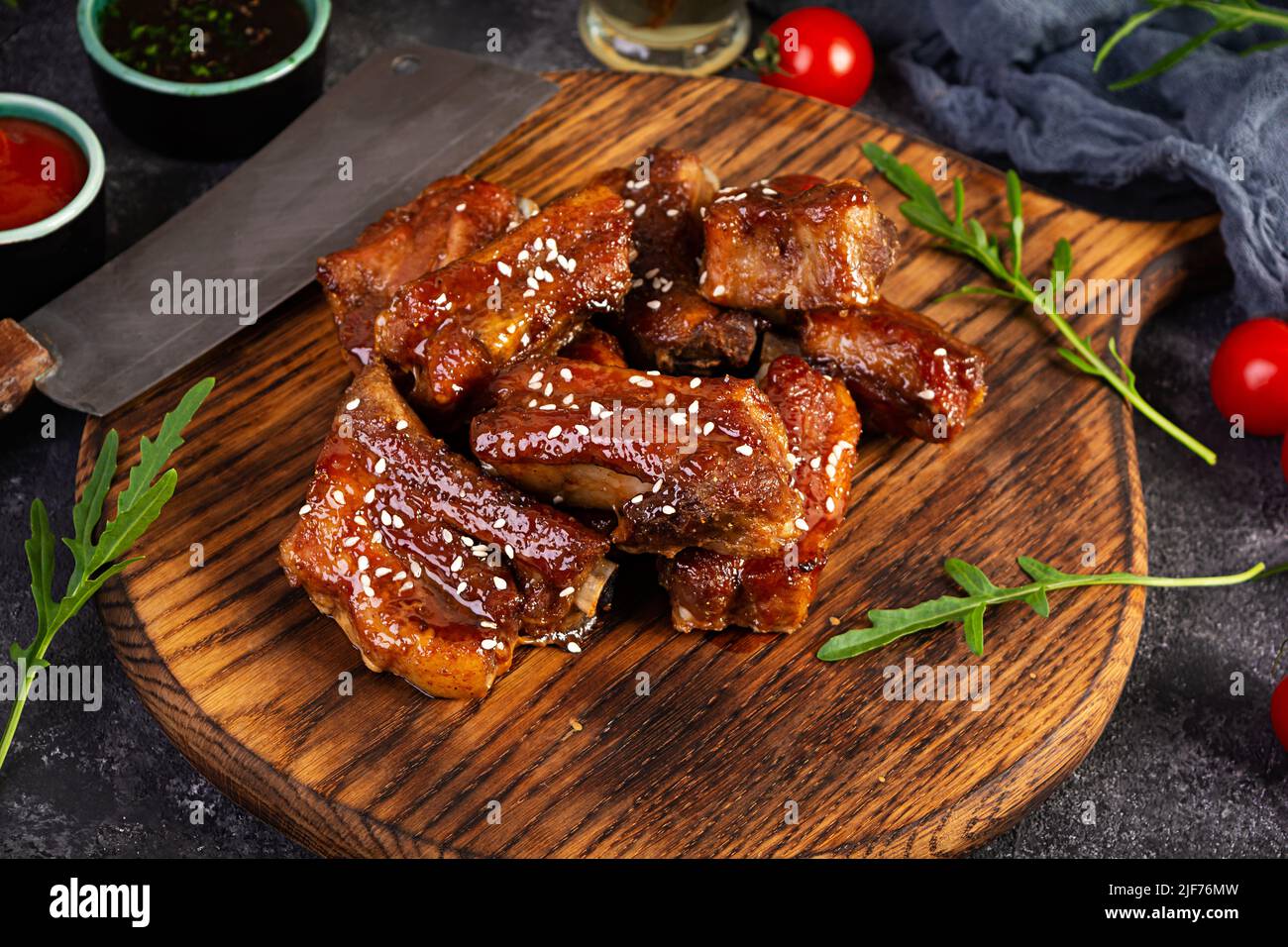 Grilled sliced ribs in sweet and sour sauce. Ribs marinated in honey ...