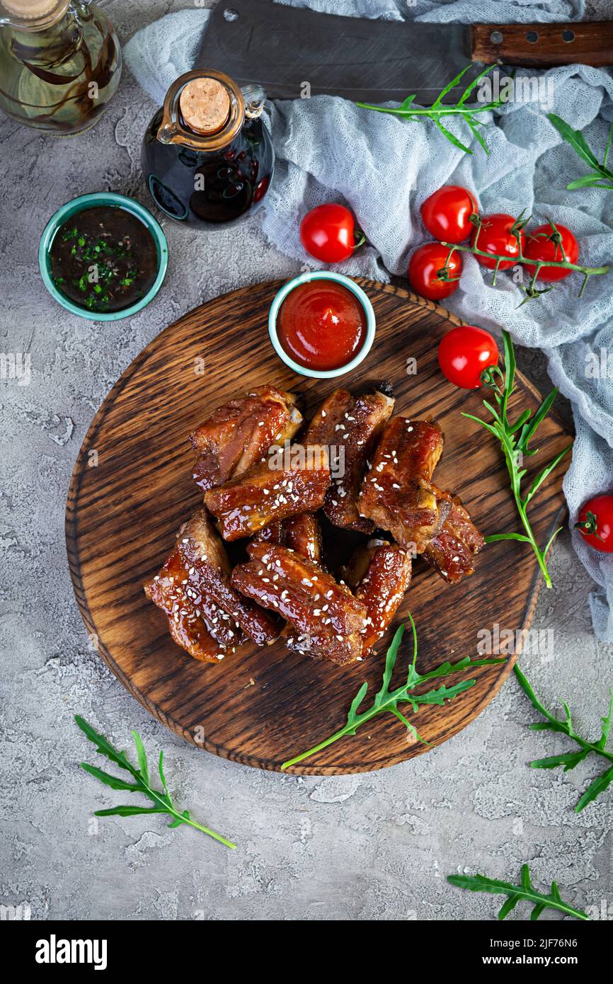 Grilled sliced ribs in sweet and sour sauce. Ribs marinated in honey ...