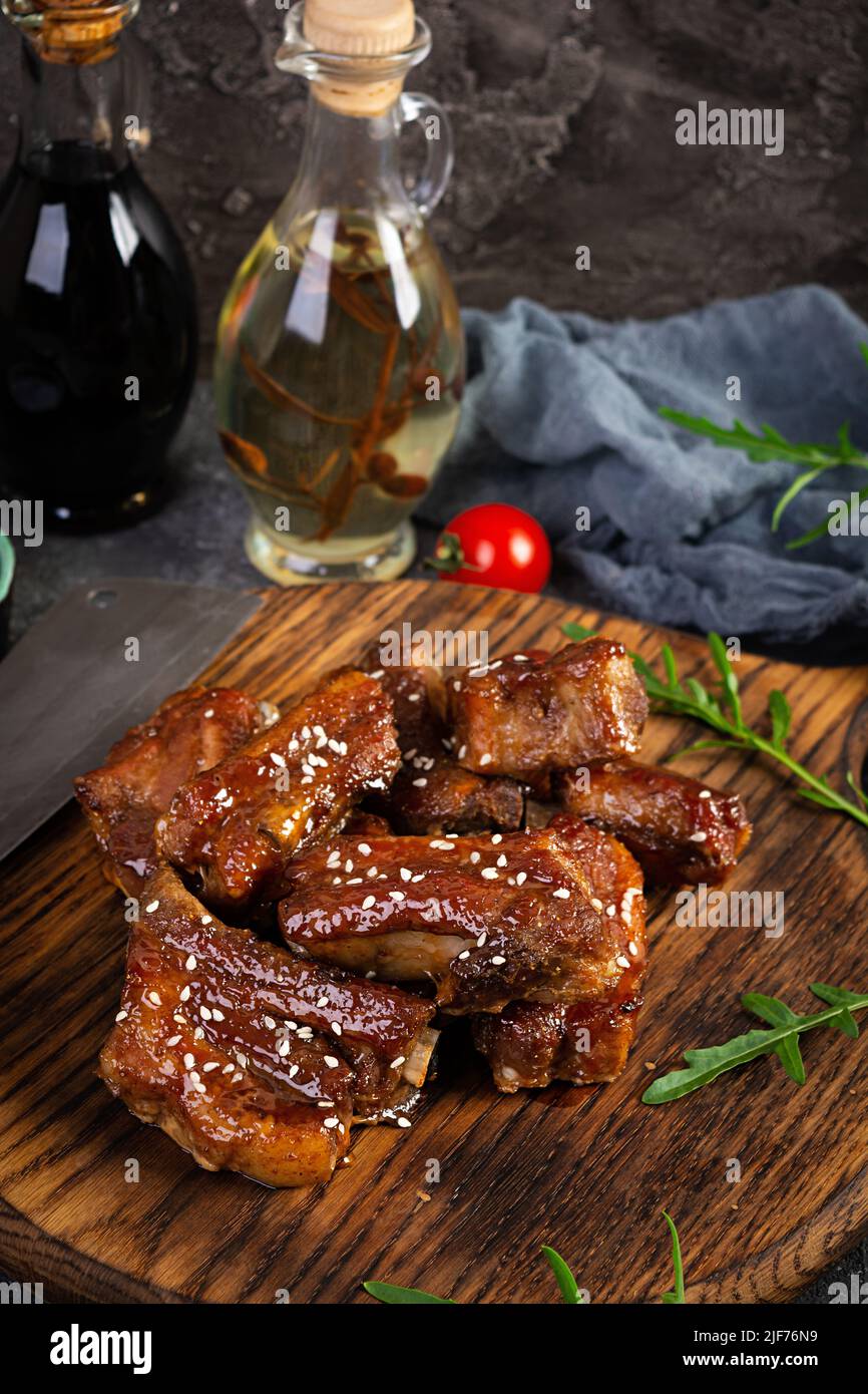 Grilled sliced ribs in sweet and sour sauce. Ribs marinated in honey ...