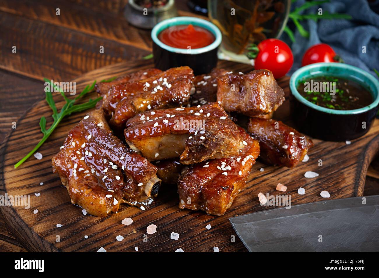 Grilled sliced ribs in sweet and sour sauce. Ribs marinated in honey ...