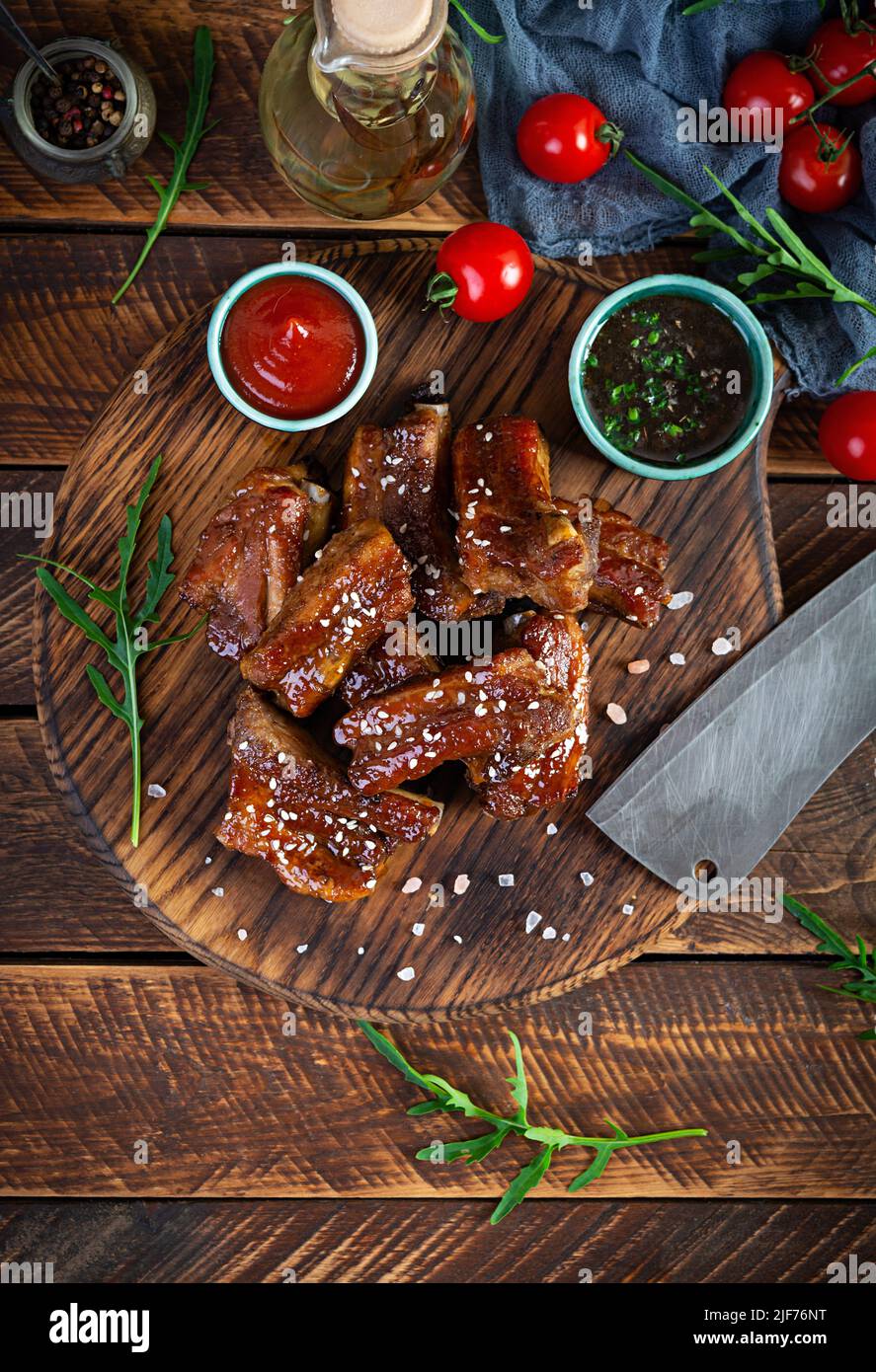 Grilled sliced ribs in sweet and sour sauce. Ribs marinated in honey ...