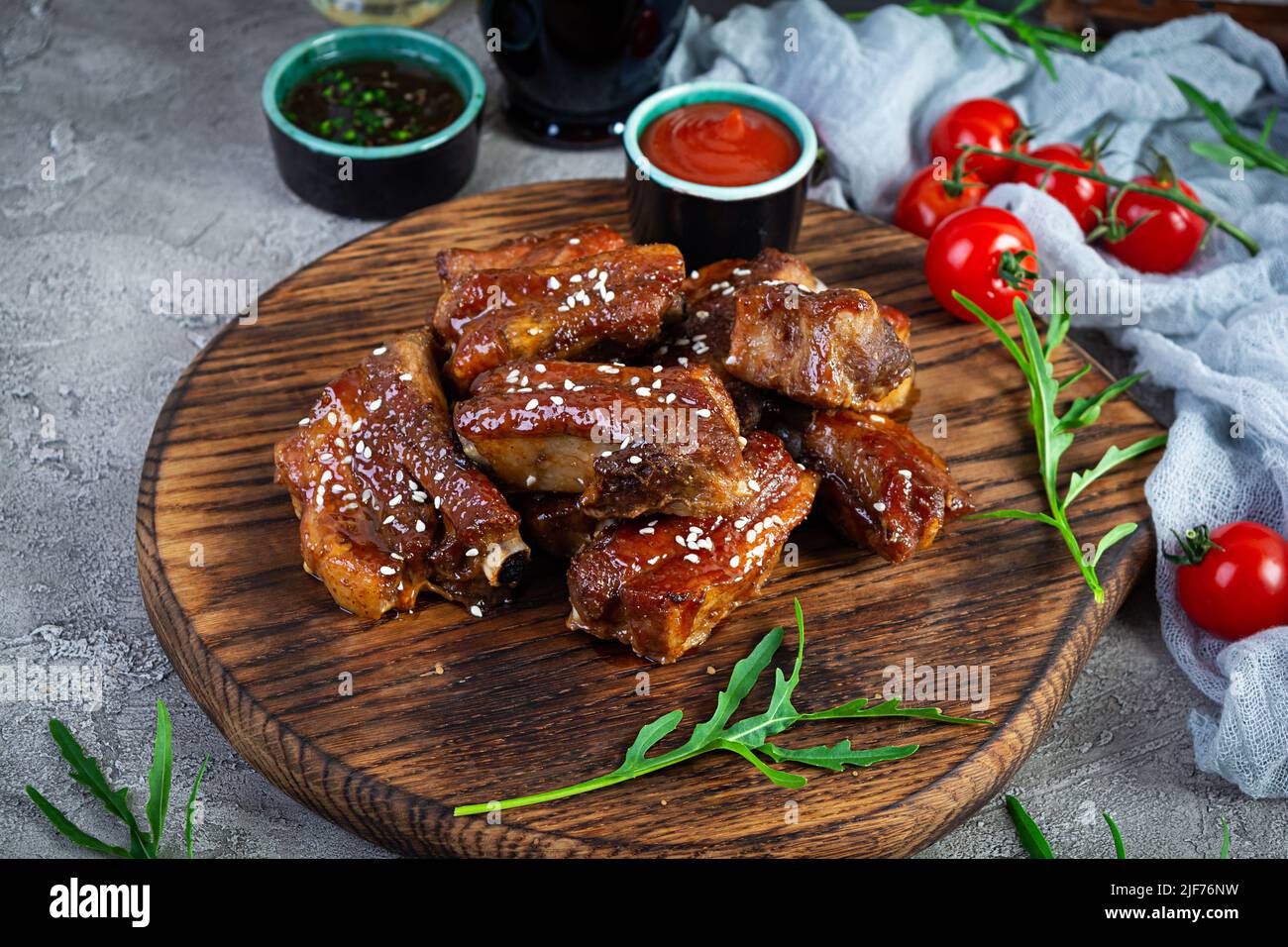 Grilled sliced ribs in sweet and sour sauce. Ribs marinated in honey ...