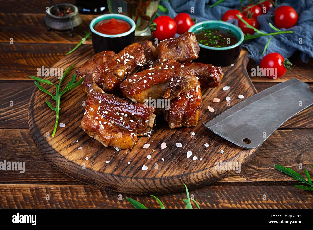 Grilled sliced ribs in sweet and sour sauce. Ribs marinated in honey ...