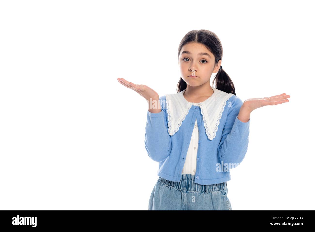 Confused schoolgirl showing shrug gesture isolated on white Stock Photo ...