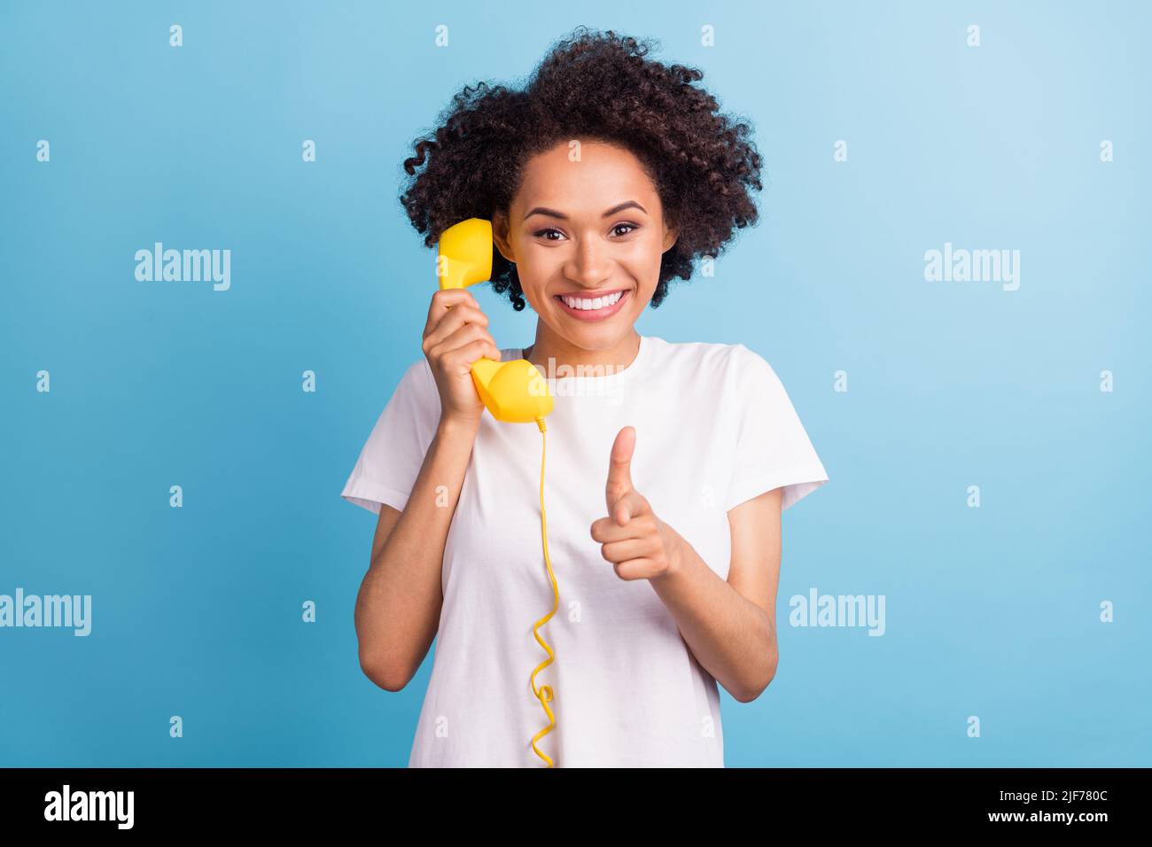 Portrait of attractive brunette cheerful girl calling pointing at you ...