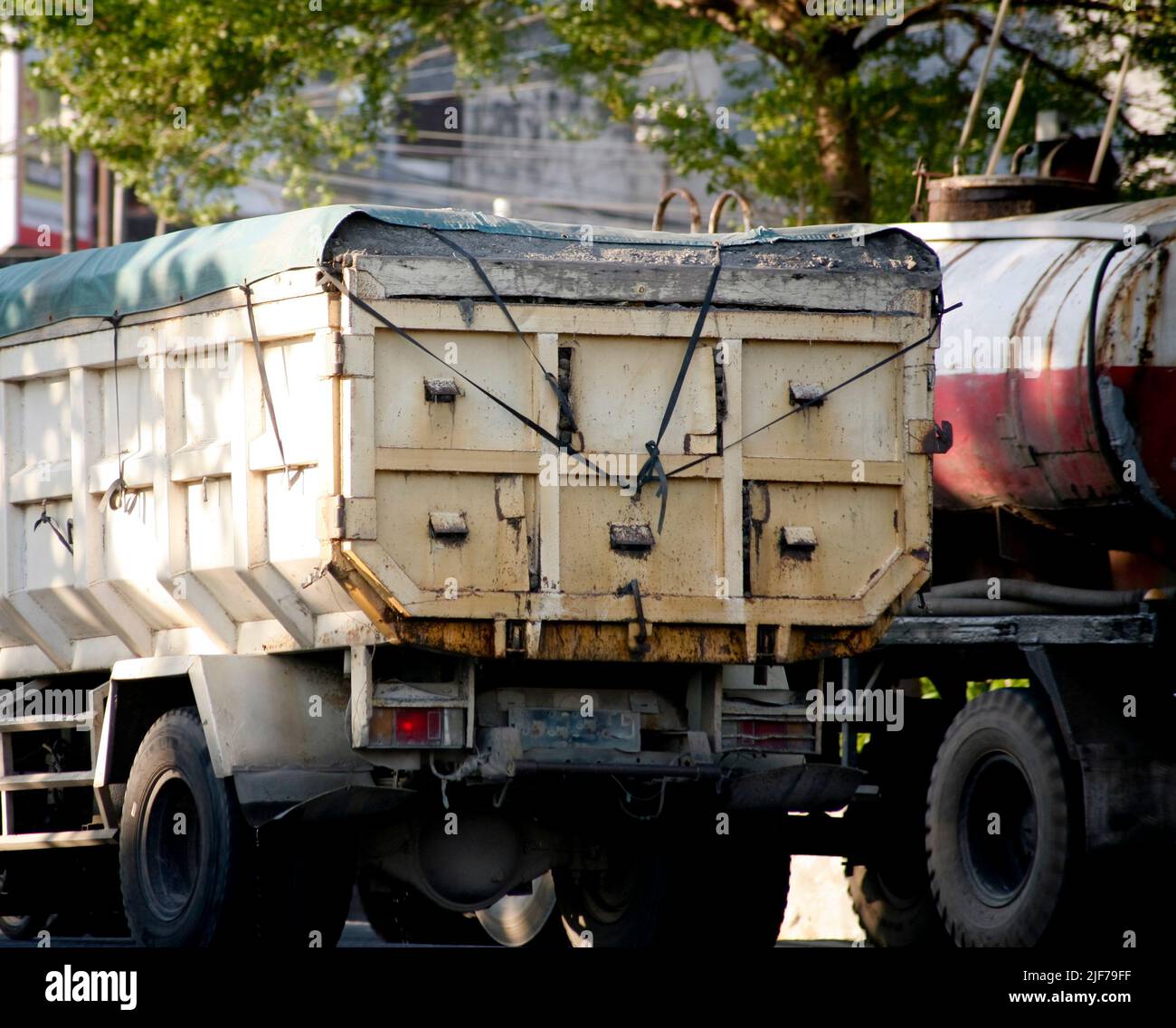Rear and side view of container truck with plastic sheeting Stock Photo ...