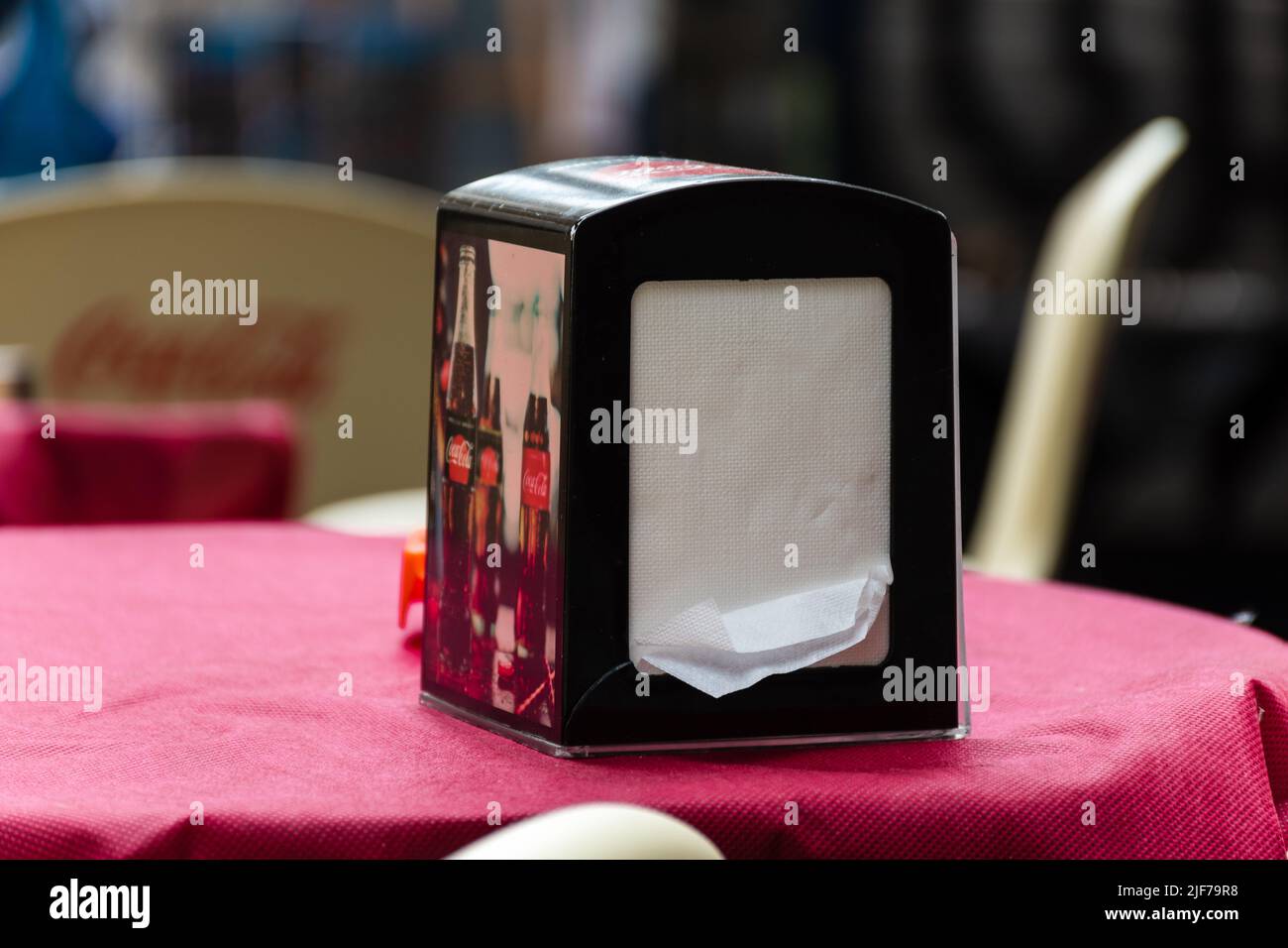 Naples, Italy. May 27, 2022. Coca cola napkin dispenser on an outside ...