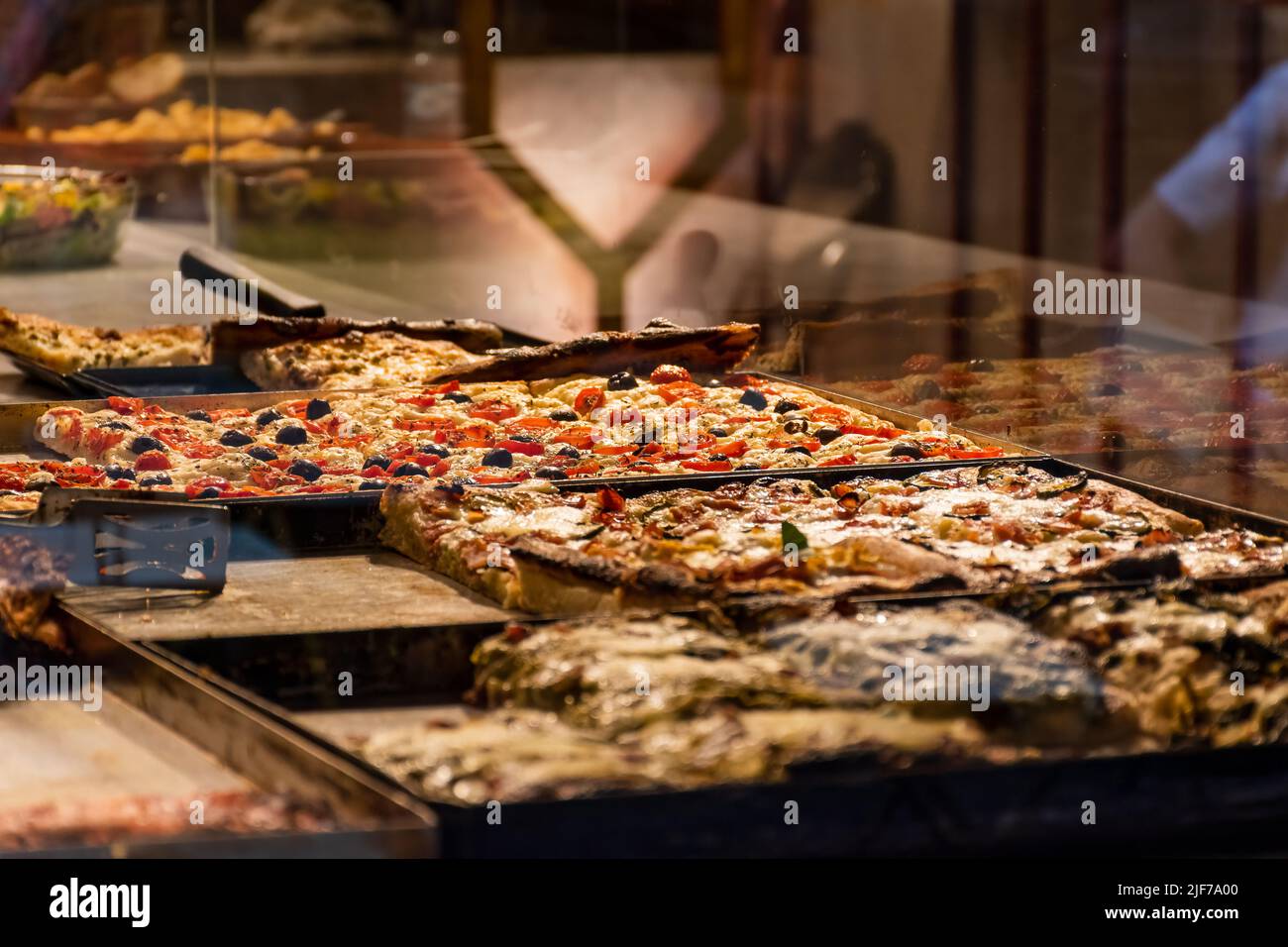 Selection of Neapolitan pizza in a restaurant display window, close up ...