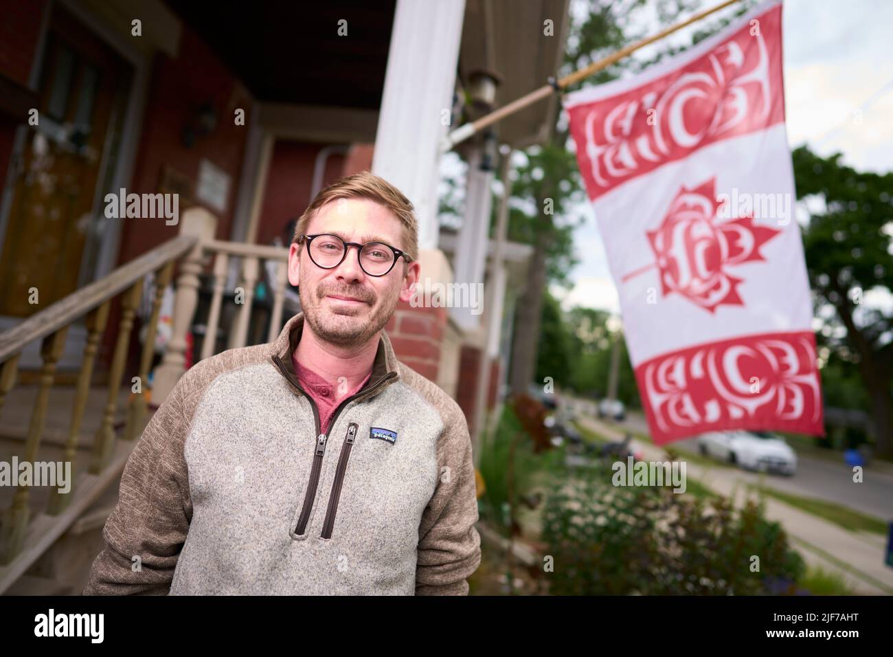 Blaine Chalk poses for a photo in front of his home in London, Ont ...