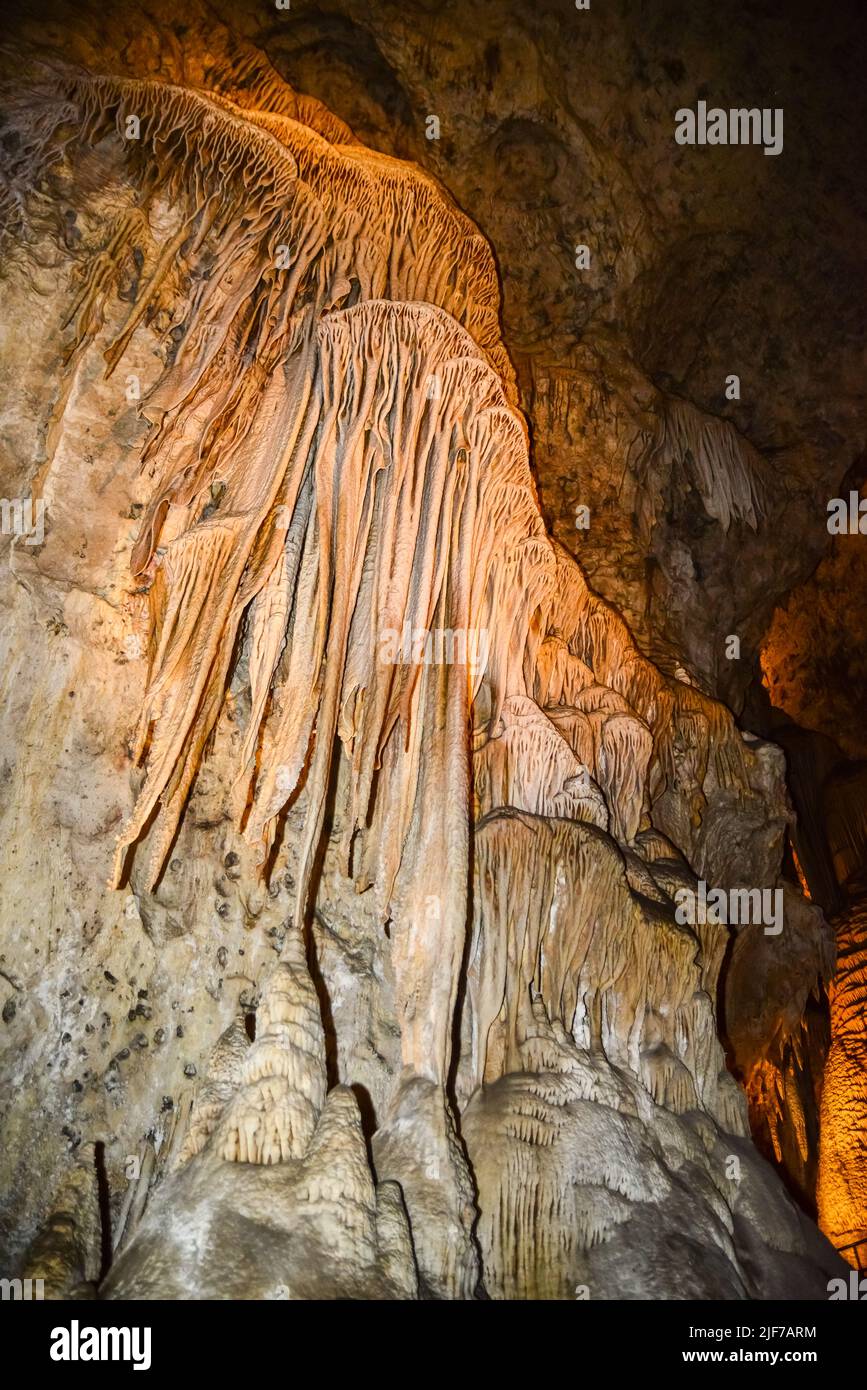 Calcite inlets, stalactites and stalagmites in large underground halls ...