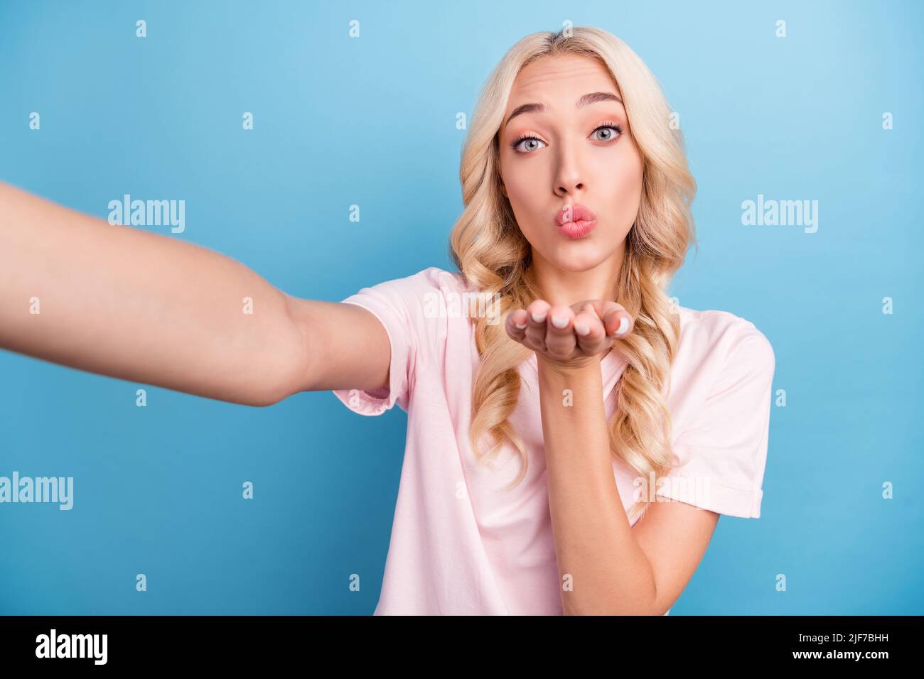 Photo of flirty millennial blond lady do selfie blow kiss wear pink t ...