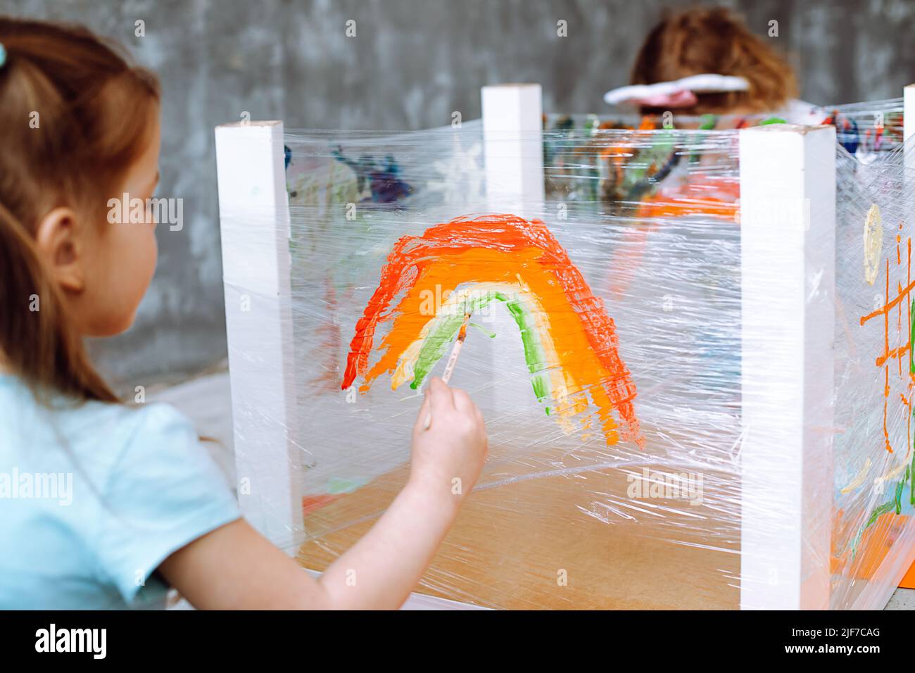 Girl child holding drawing art class hi-res stock photography and ...