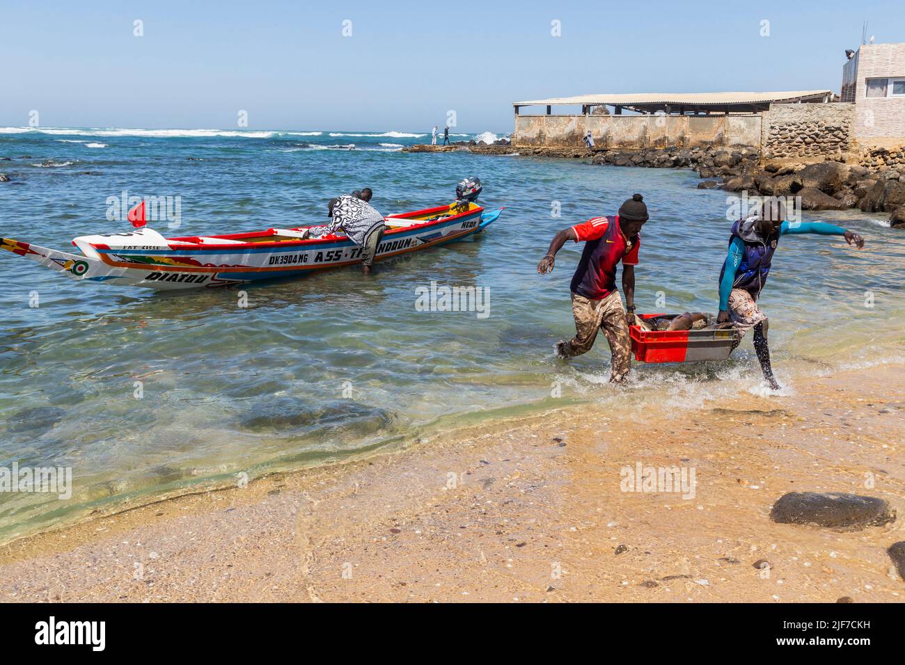 Dakar, Senegal. August 18, 2019: Fishermen with a fishing boat in a ...