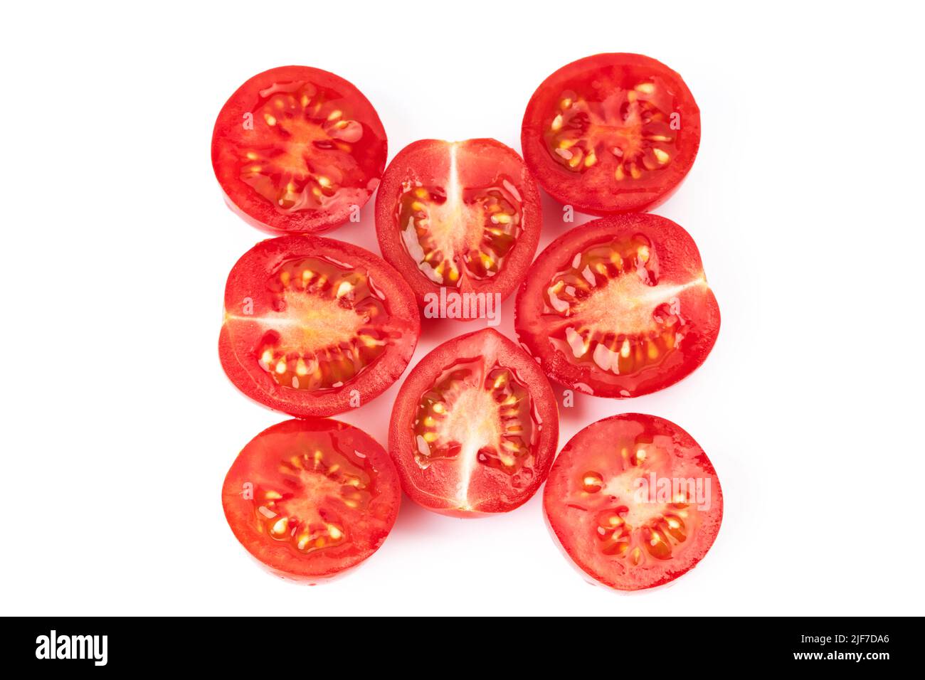 Four red ripe tomatoes cut in half. Organic food. Vegetarian and ...