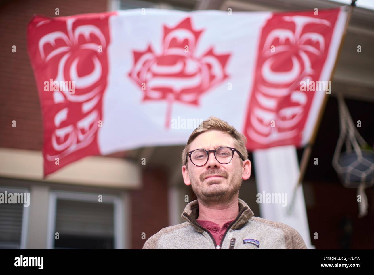 Blaine Chalk poses for a photo in front of his home in London, Ont ...
