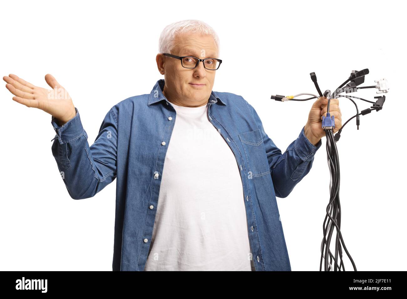 Mature man holding many cables and gesturing with hand isolated on ...