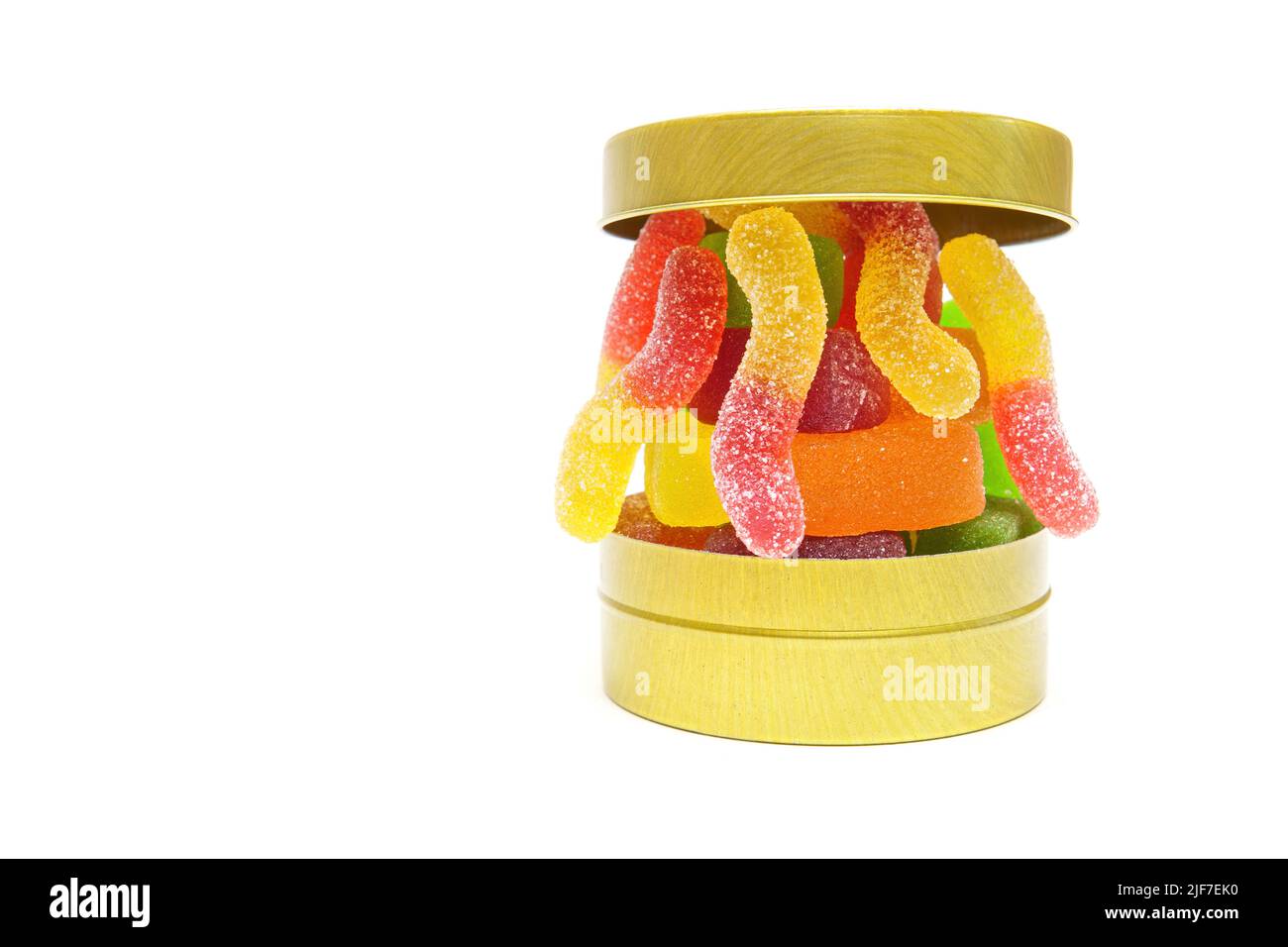 Worm-shaped jelly candies in a round tin box isolated on white ...