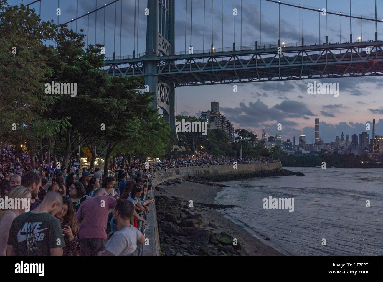 NEW YORK, NY - JUNE 29: Spectators gather for the Central Astoria ...