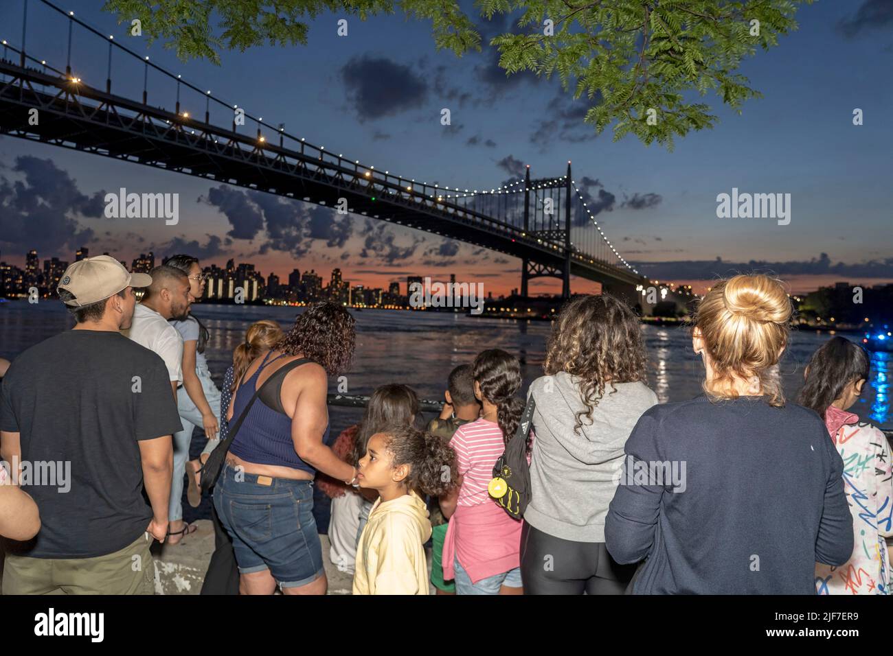 NEW YORK, NY - JUNE 29: Spectators gather for the Central Astoria ...