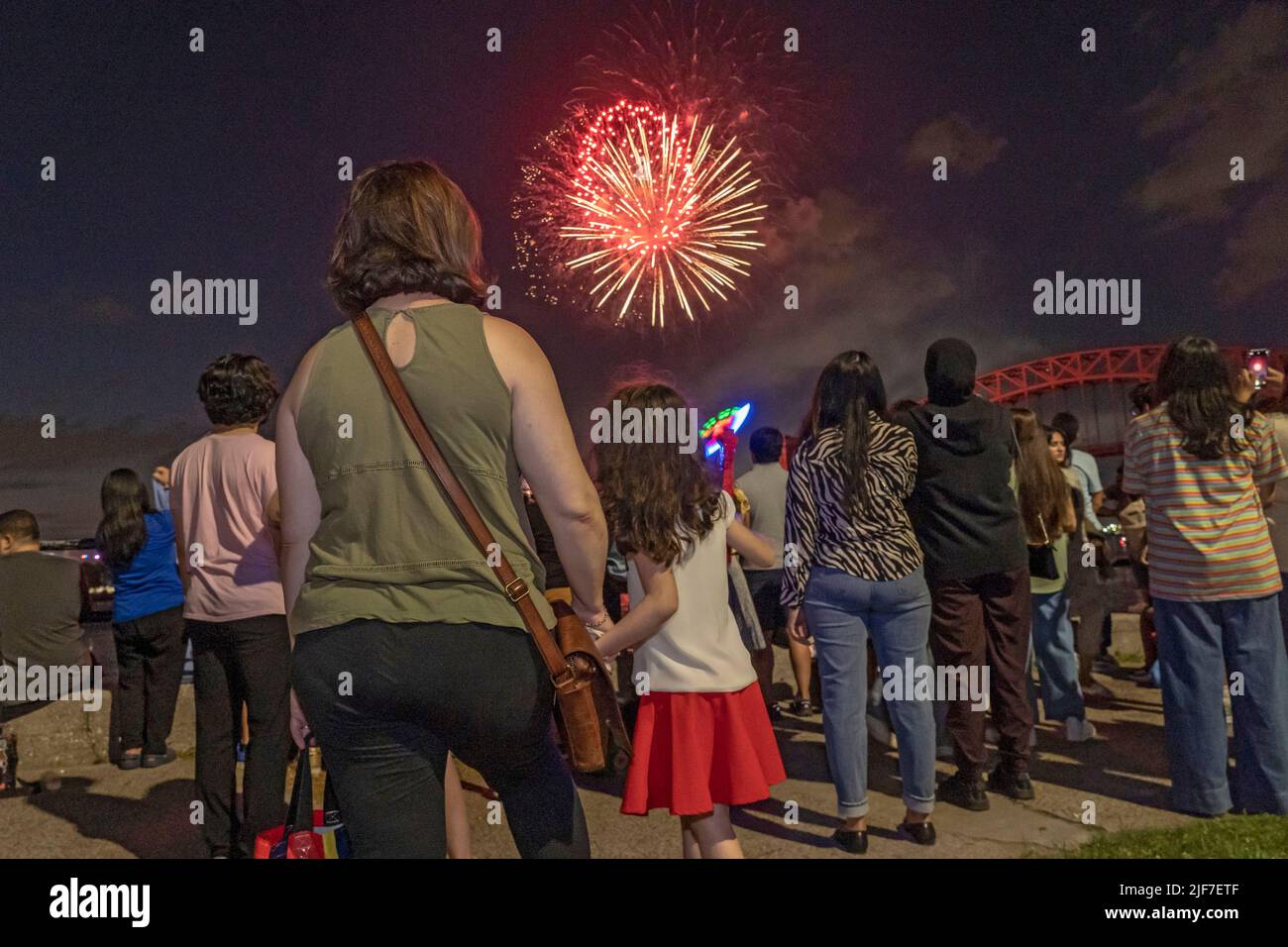 NEW YORK, NY - JUNE 29: People with kids watch fireworks explode during ...