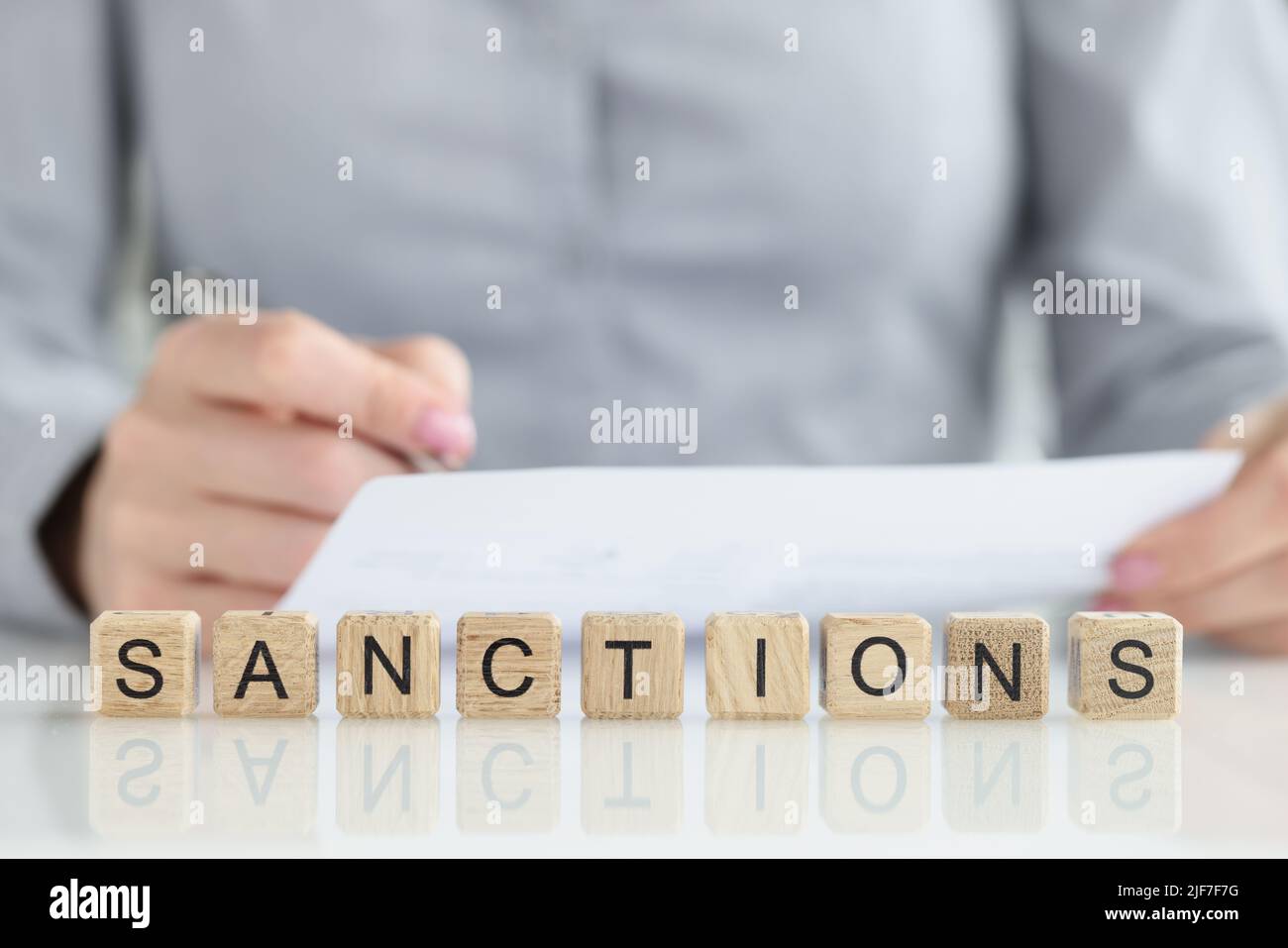 Text sanctions list on white note paper Stock Photo - Alamy