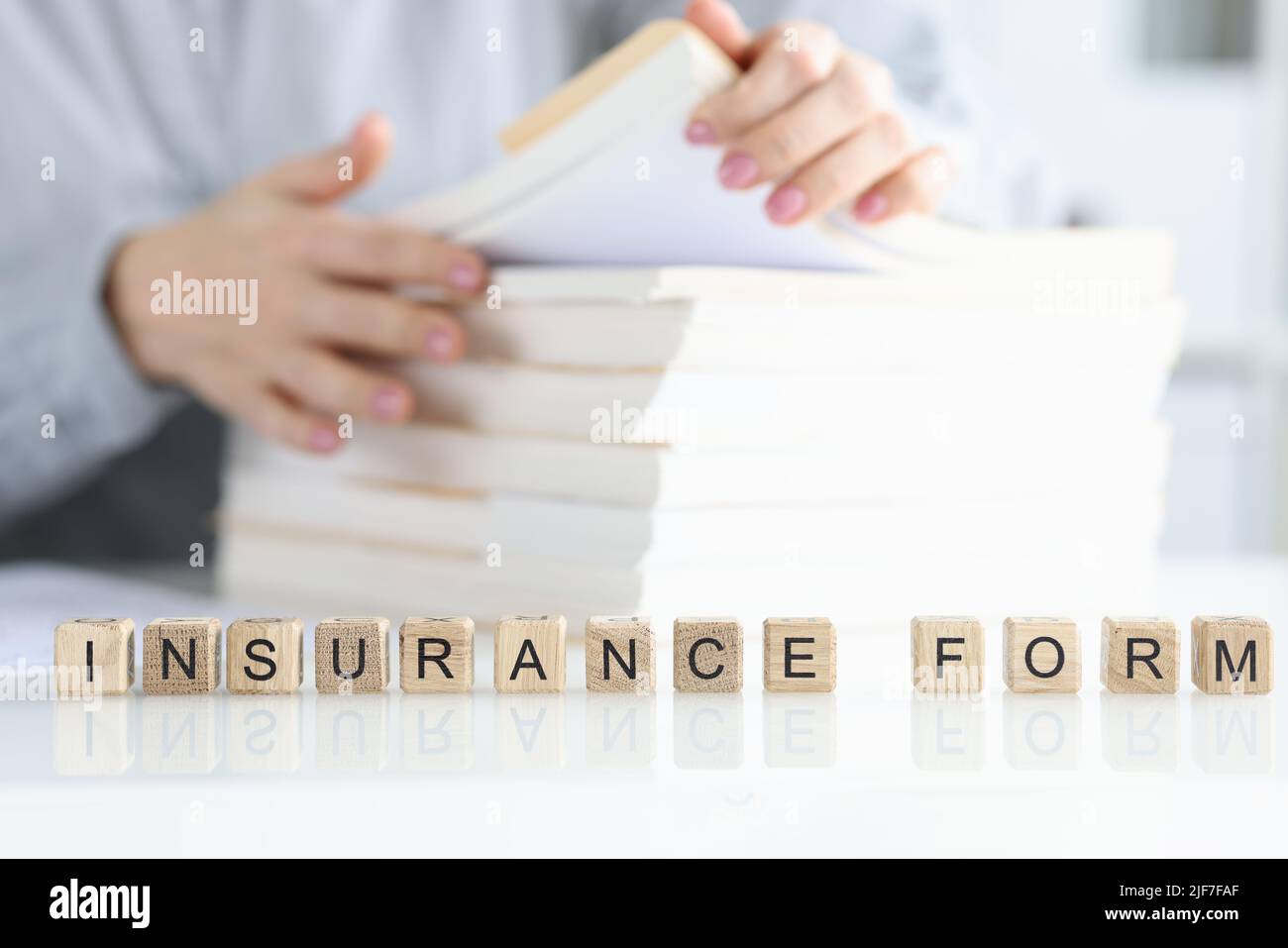 Insurance agent is looking for client insurance form closeup Stock ...