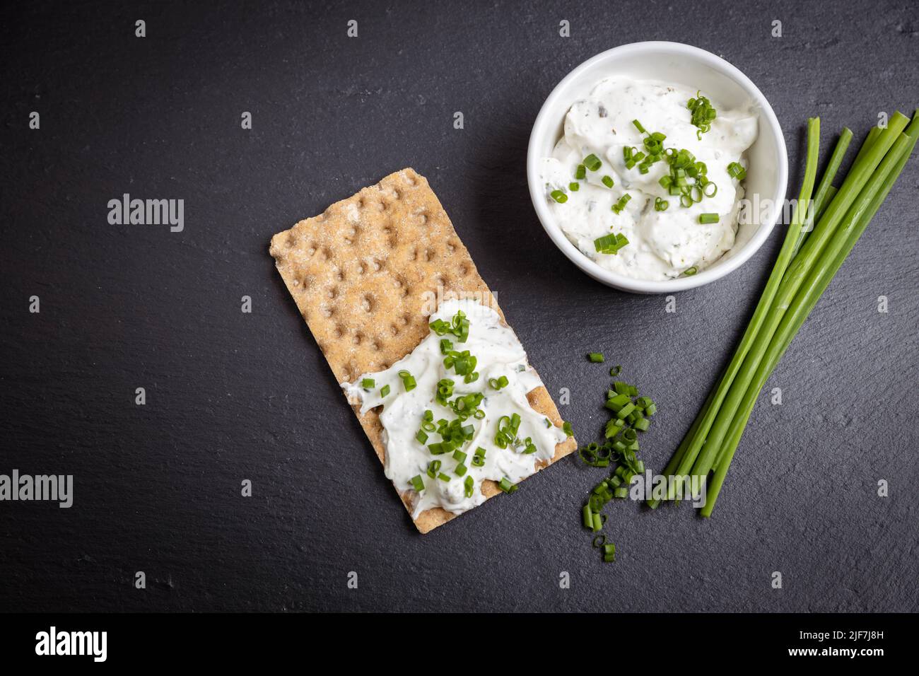 breakfast with crispbread and quark and fresh cut chives Stock Photo ...