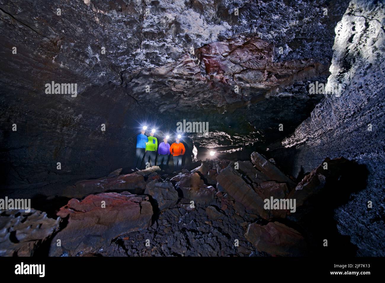 group of scientists exploring the Leidarendi lava cave in Iceland Stock ...