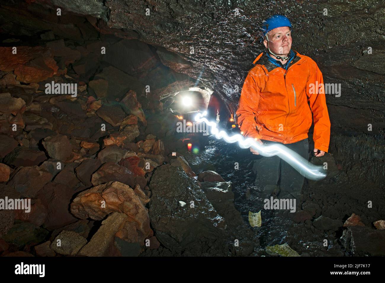 group of scientists exploring the Leidarendi lava cave in Iceland Stock ...
