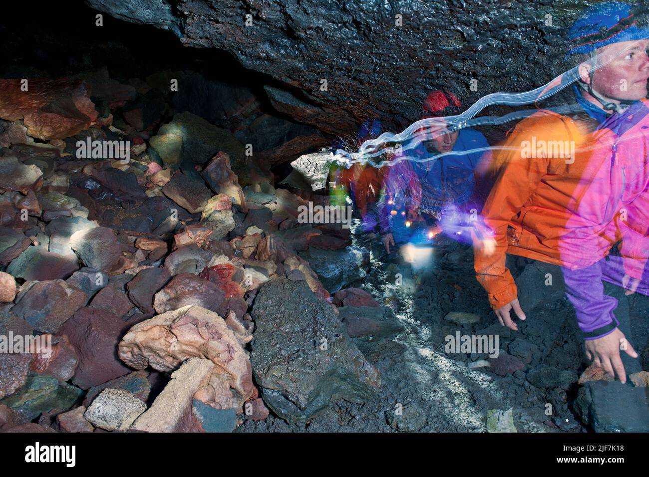 group of scientists exploring the Leidarendi lava cave in Iceland Stock ...