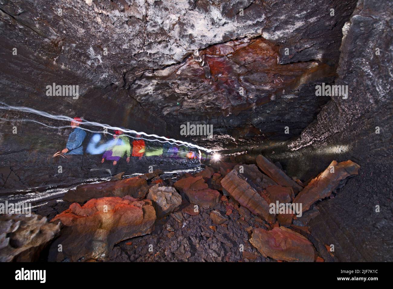 group of scientists exploring the Leidarendi lava cave in Iceland Stock ...