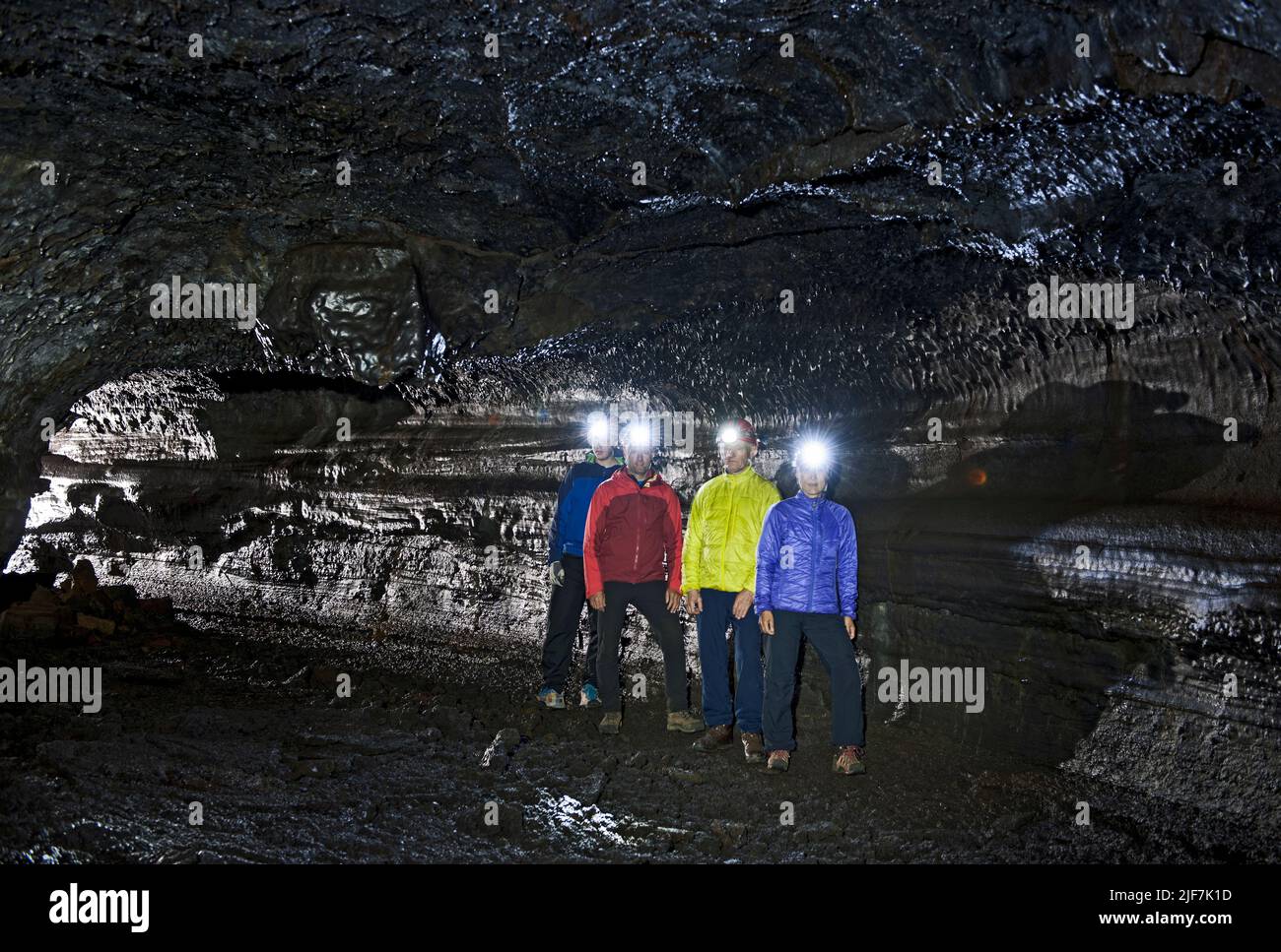 group of scientists exploring the Leidarendi lava cave in Iceland Stock ...
