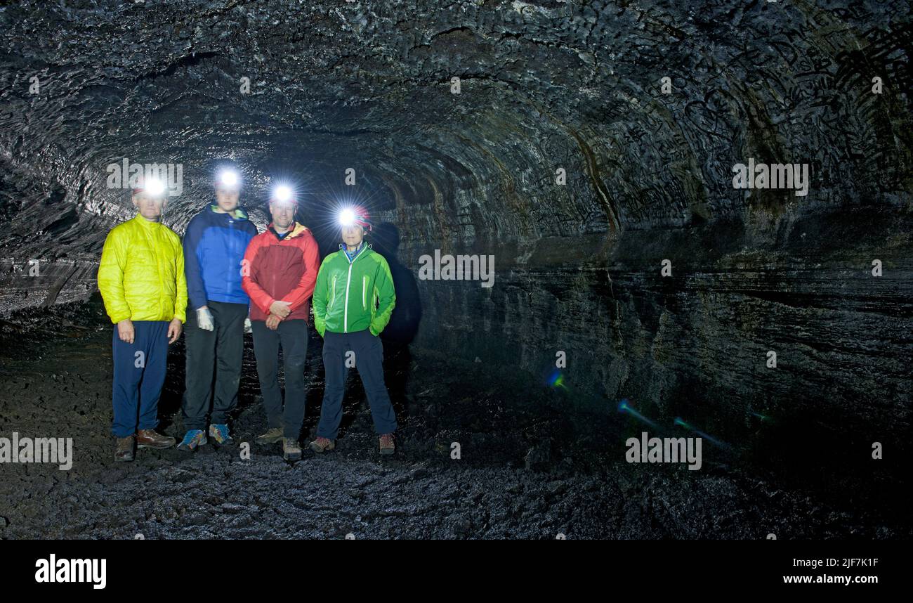 group of scientists exploring the Leidarendi lava cave in Iceland Stock ...