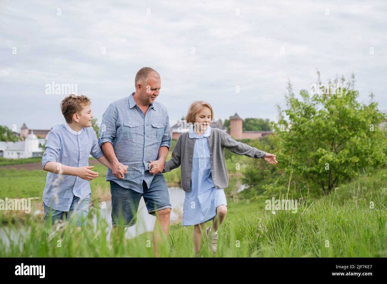 Two children talking to adult hi-res stock photography and images - Alamy