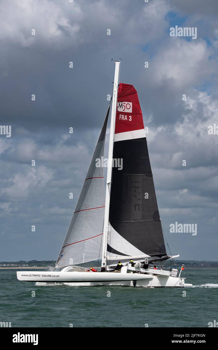 Carbon Fibre Racing Yacht Spirit of Poole skims briskly along the ...