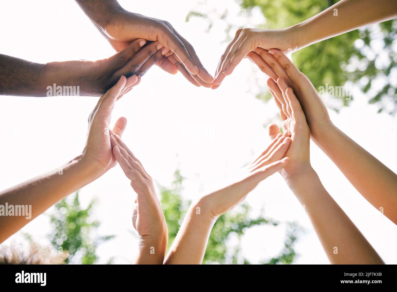 Multiracial hands making a circle hi-res stock photography and images ...