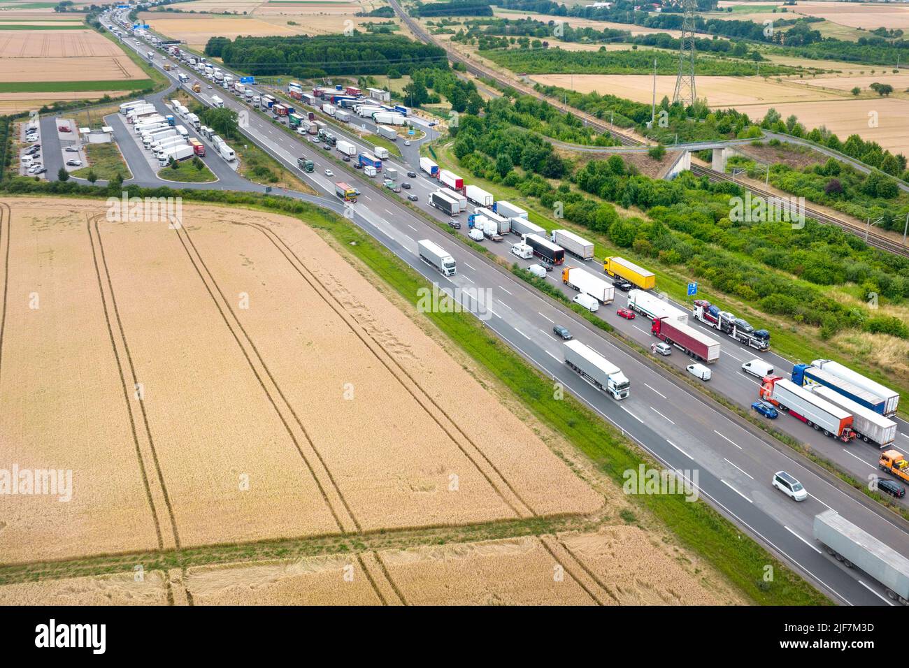 Dense traffic on highway. Rest area for cars and trucks - aerial view ...
