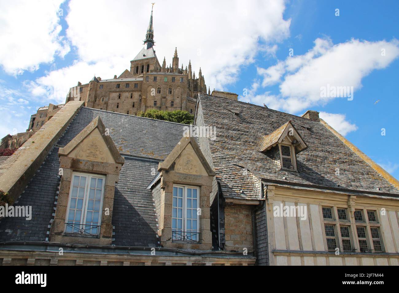 old houses and medieval abbey at le mont-saint-michel in normandy ...