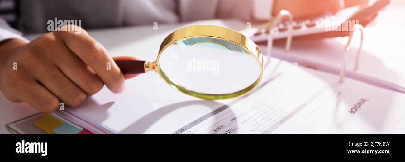 Photo Of Businesswoman Analyzing Invoice With Magnifying Glass Stock ...