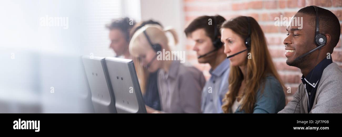 Young Call Center Team Talking With Customers Stock Photo - Alamy